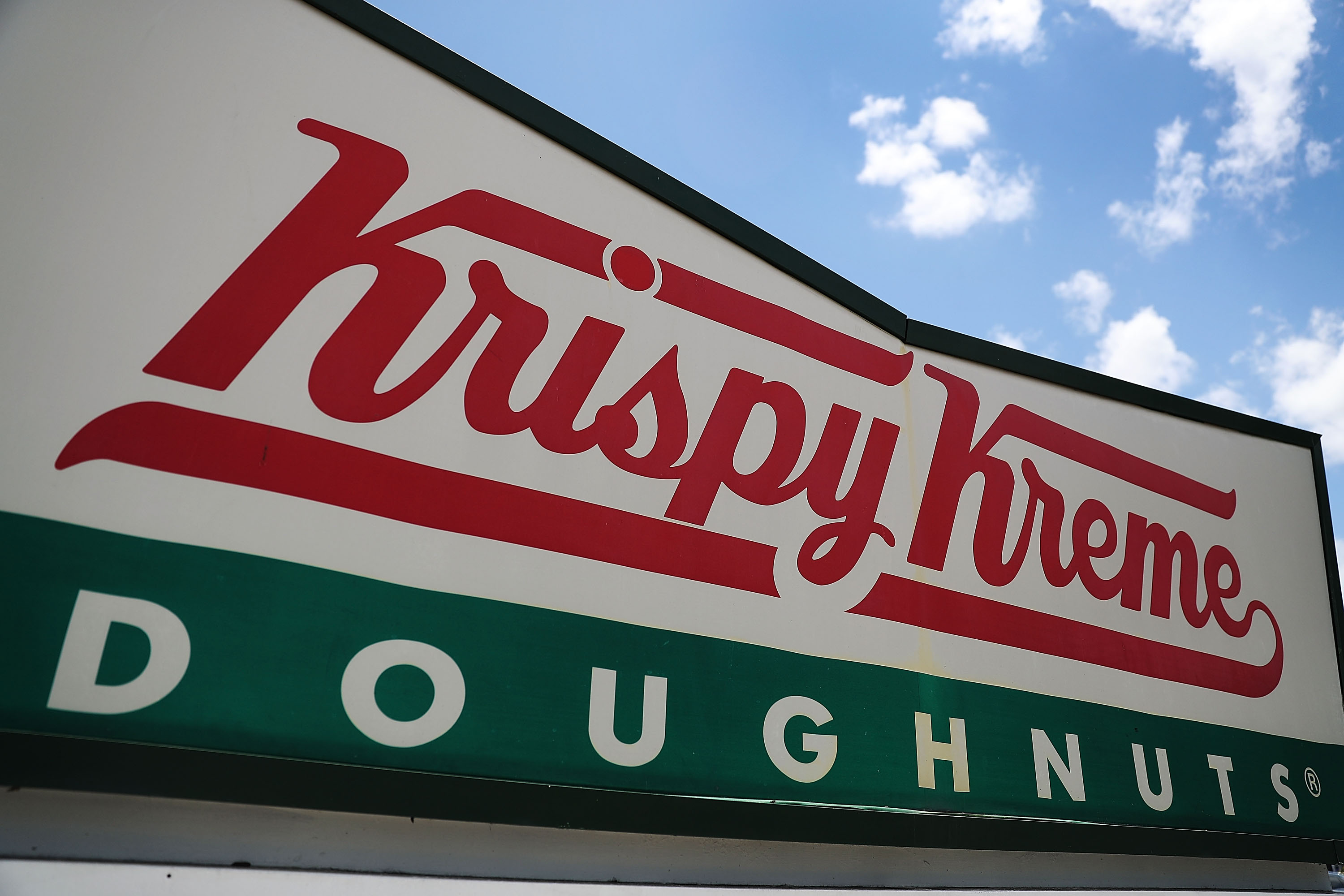 Krispy Kreme using chocolate glaze on famous donuts for upcoming Solar ...
